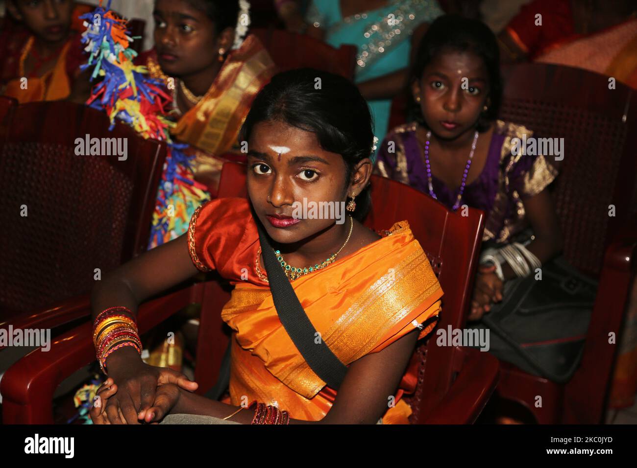 Tamil children wait to perform in a special cultural program featuring ...