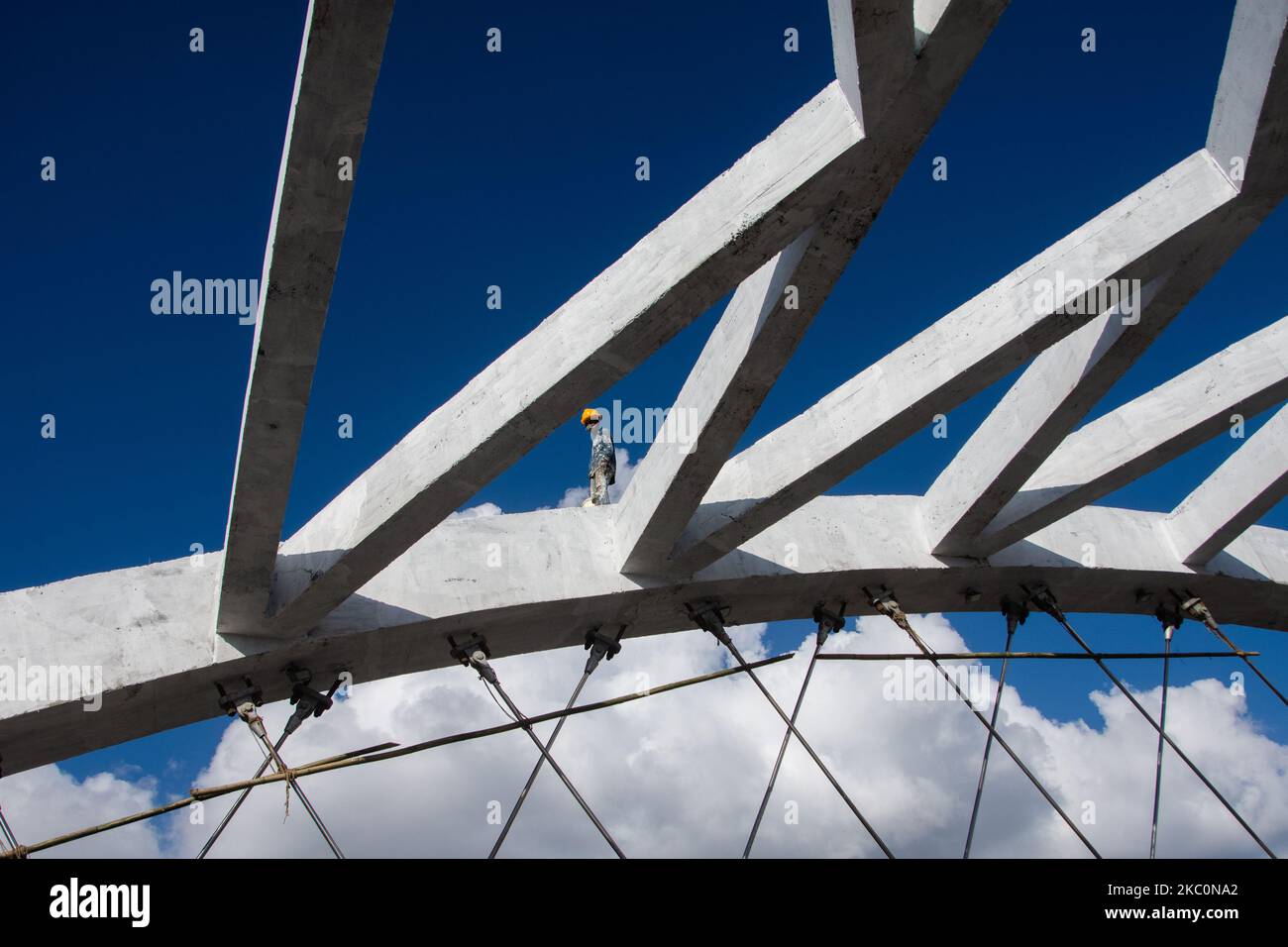 Nepalese construction worker paint a newly built bridge at Kathmandu ...