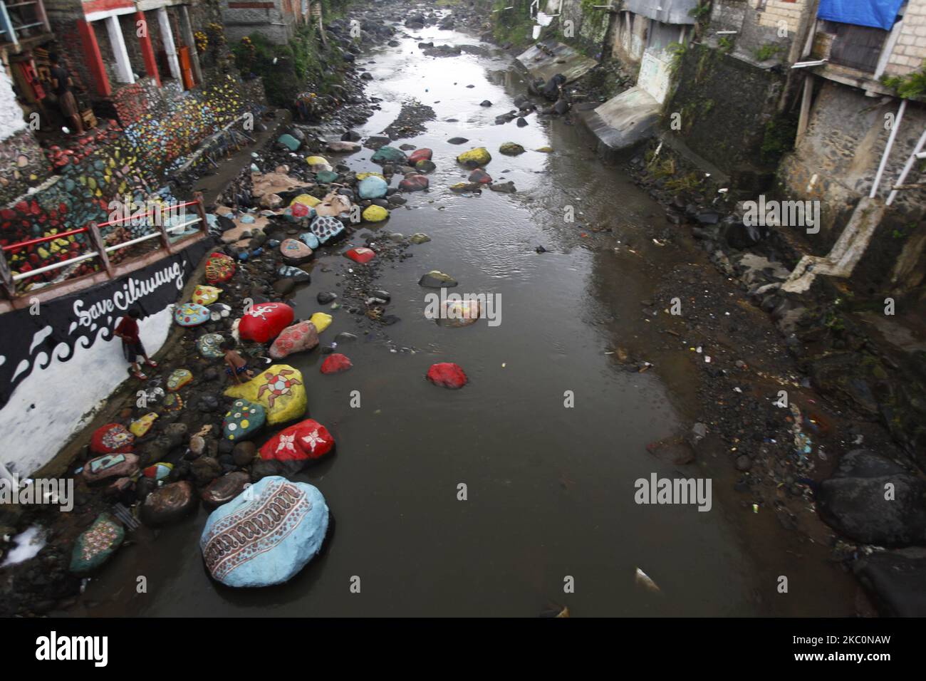 Indonesian children playing at the Ciliwung river in Bogor, West Java ...