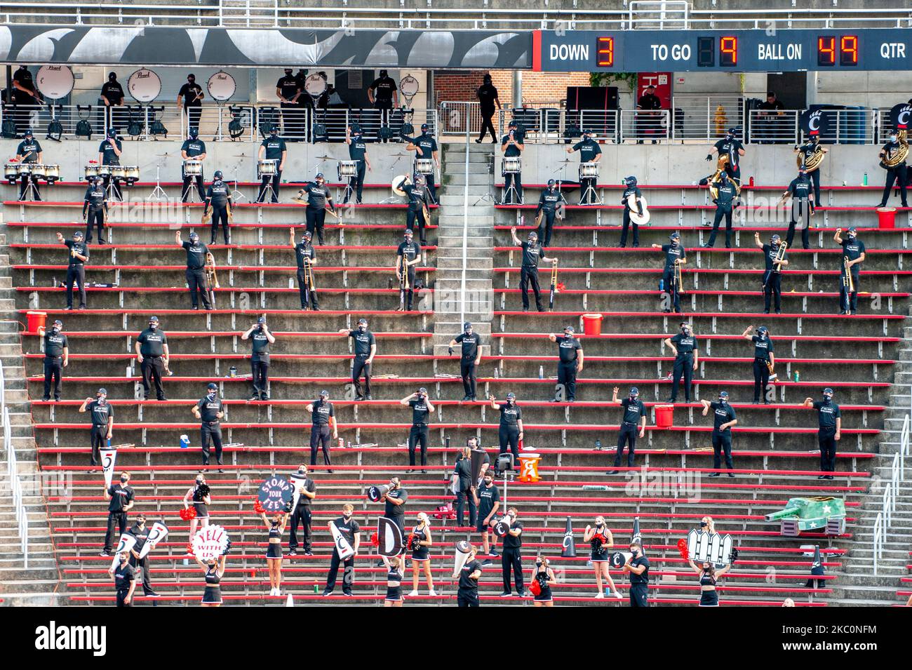 The University of Cincinnati cheerleaders and drill team perform during ...