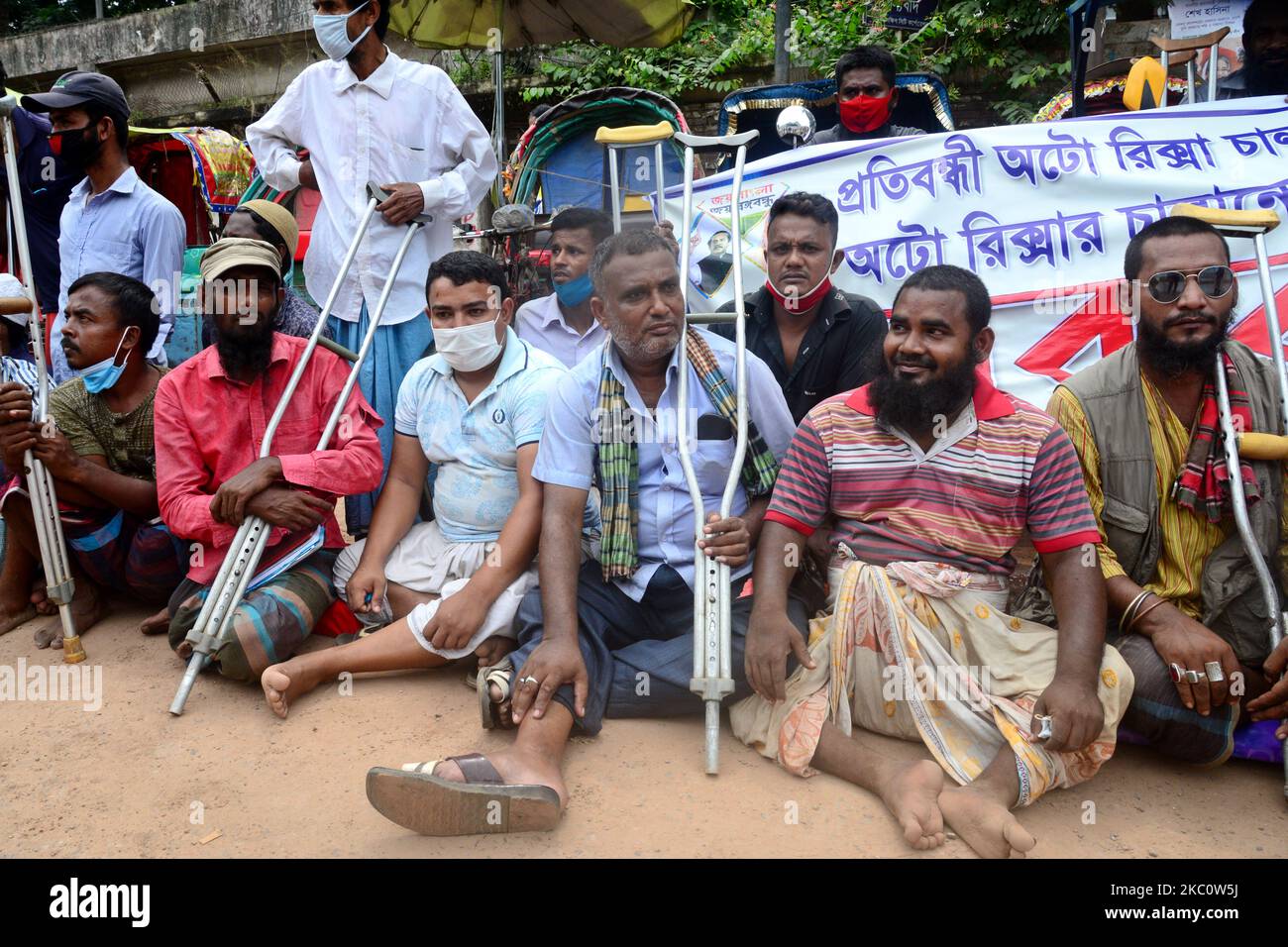 Bangladeshi Disable auto rickshaw driver held a human chain demanding ...