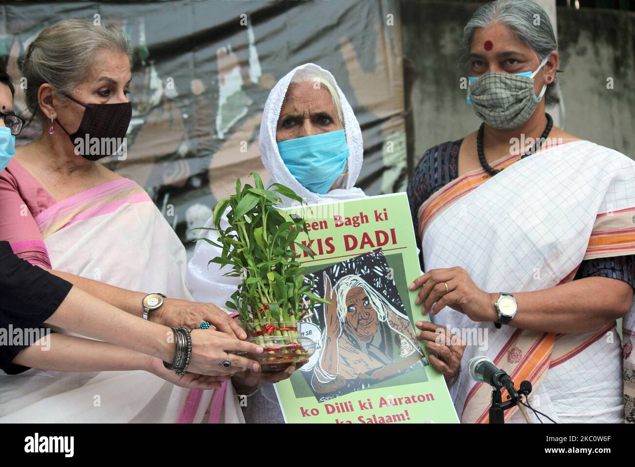Bilkis 'Dadi', (C) grandmother of Shaheen Bagh during her felicitation by members of various ...