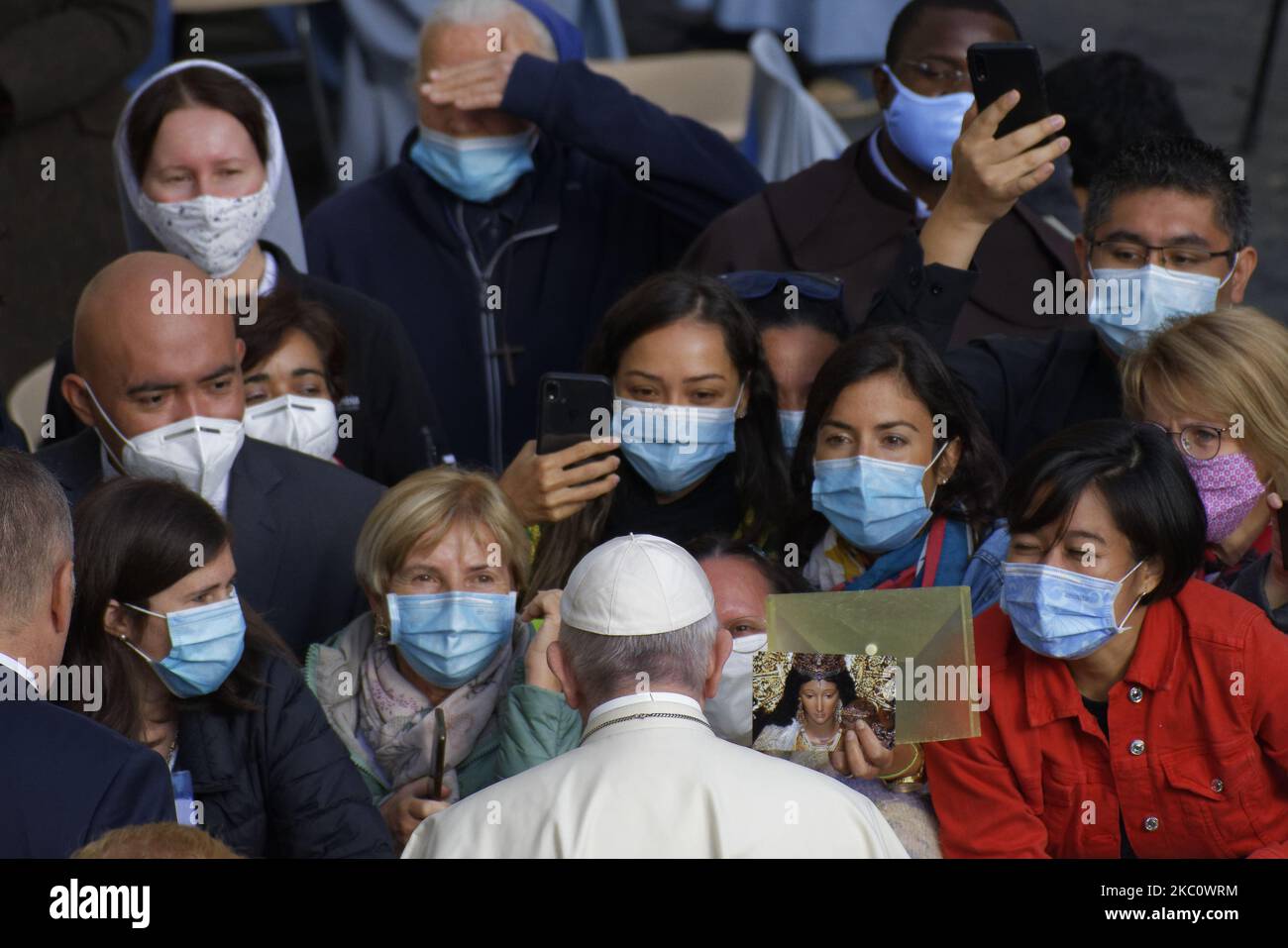 Faithful wearing face masks to prevent the spread of COVID-19 reach out ...