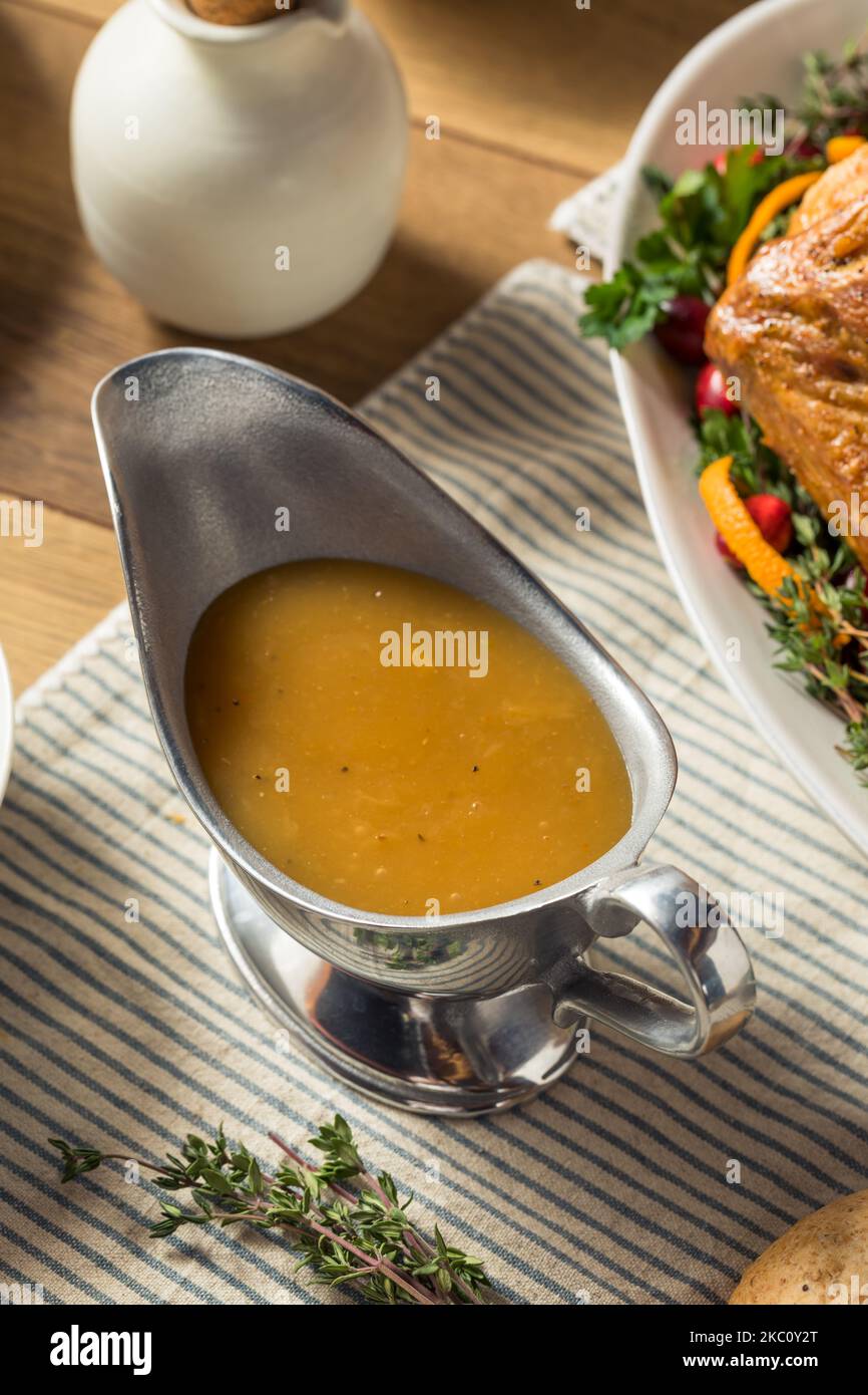 Homemade Thanksgiving Turkey Gravy in a Boat Stock Photo - Alamy