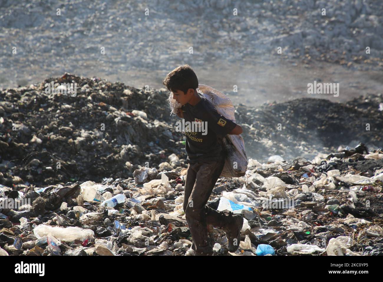 Amidst piles of garbage near the town of Qah in the northern ...