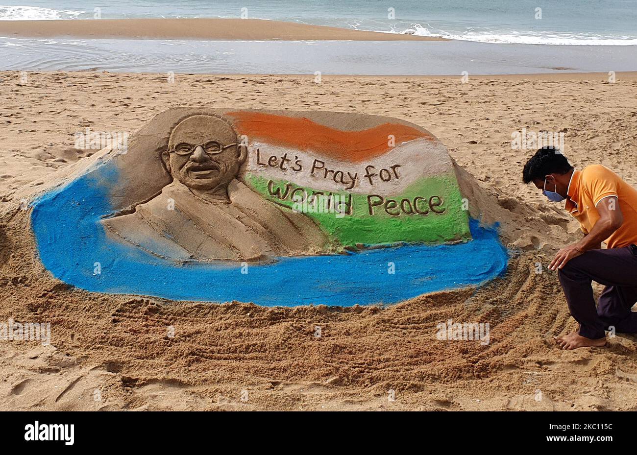 Father of Nation, Mahatma Gandhi's sand sculpture is seen at the Bay of ...