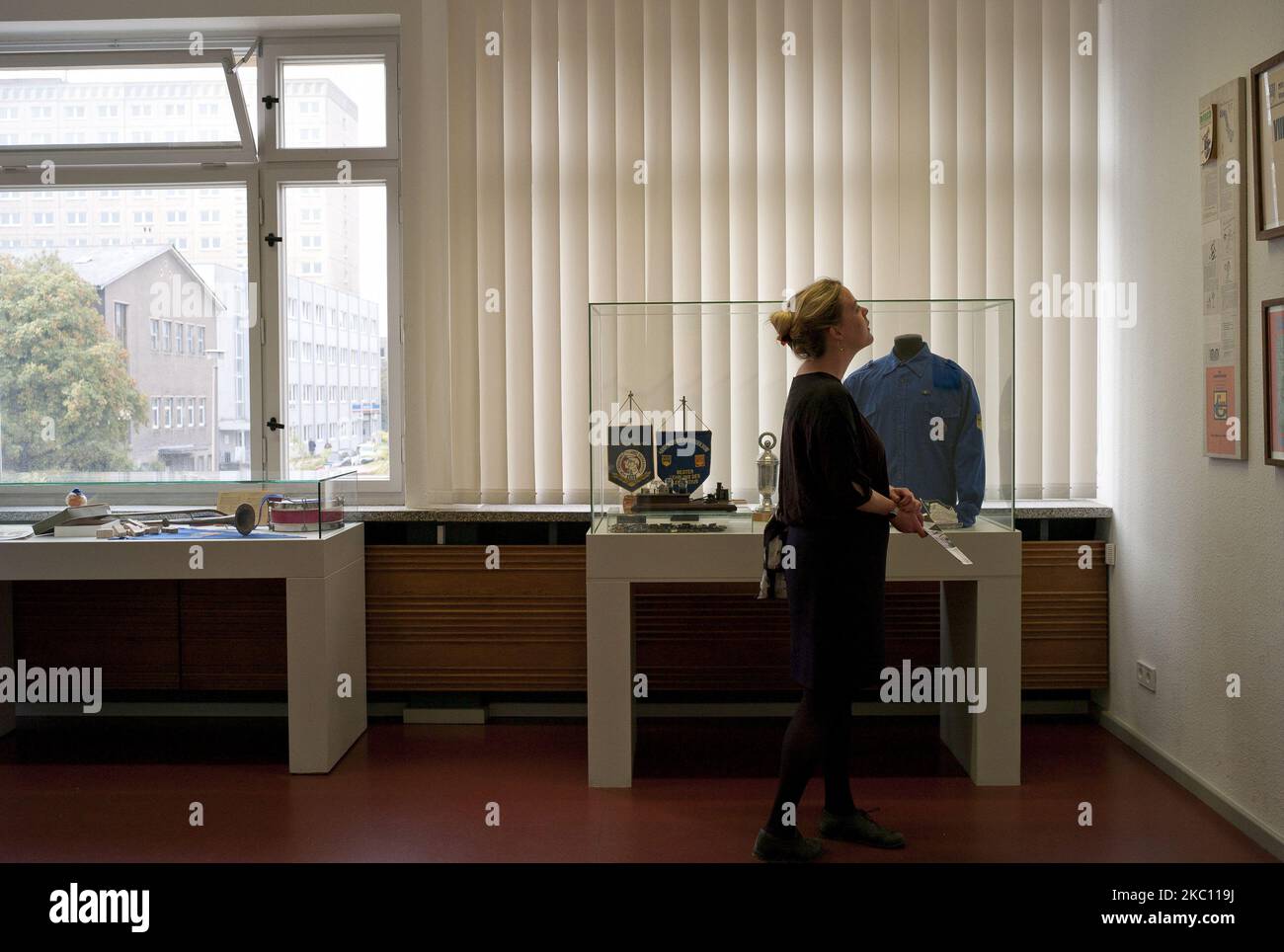 Visitors look at exhibits of Stasi surveillance post to show what ...