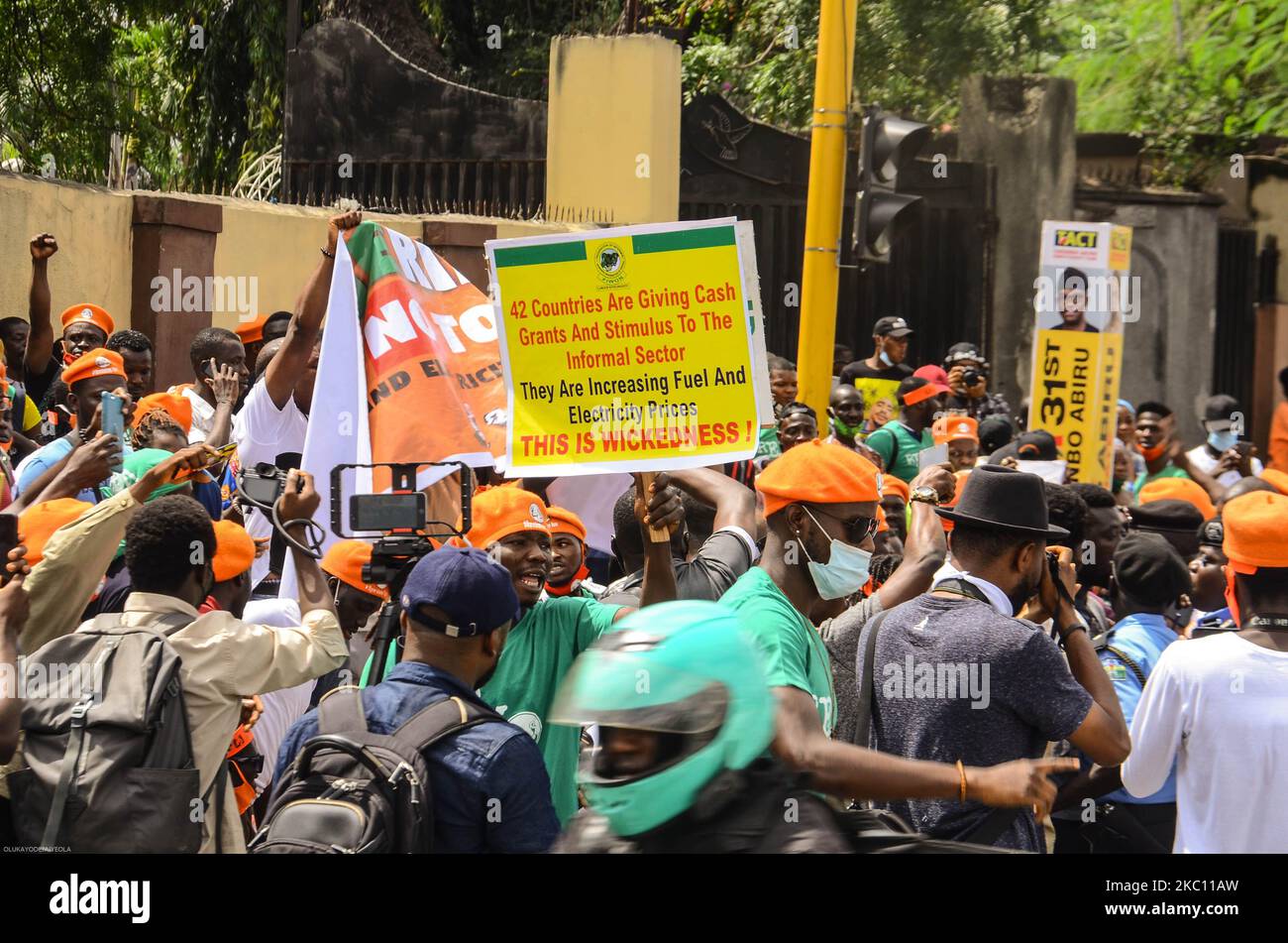Protesters of Revolution Now hold sign bearing price of electricity and ...