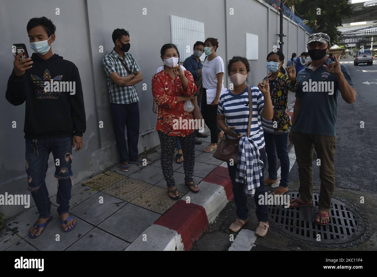 Myanmar citizens in Thailand, shows his finger after casting his vote ...