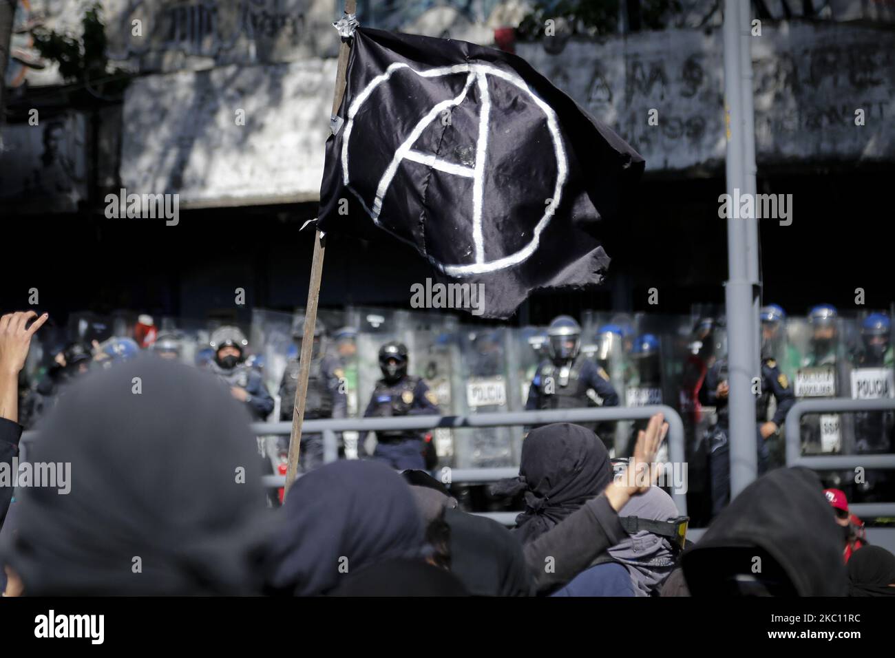 An anarchist flag is seen during a demonstration on October 2, 2020 in ...