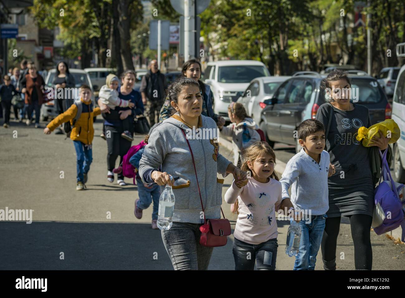 Families run to buses for their evacuation to Yerevan after increasing ...