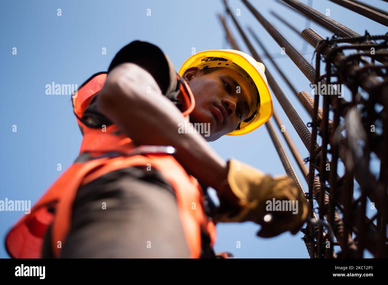 Nepalese workers working at a construction site of new federal ...