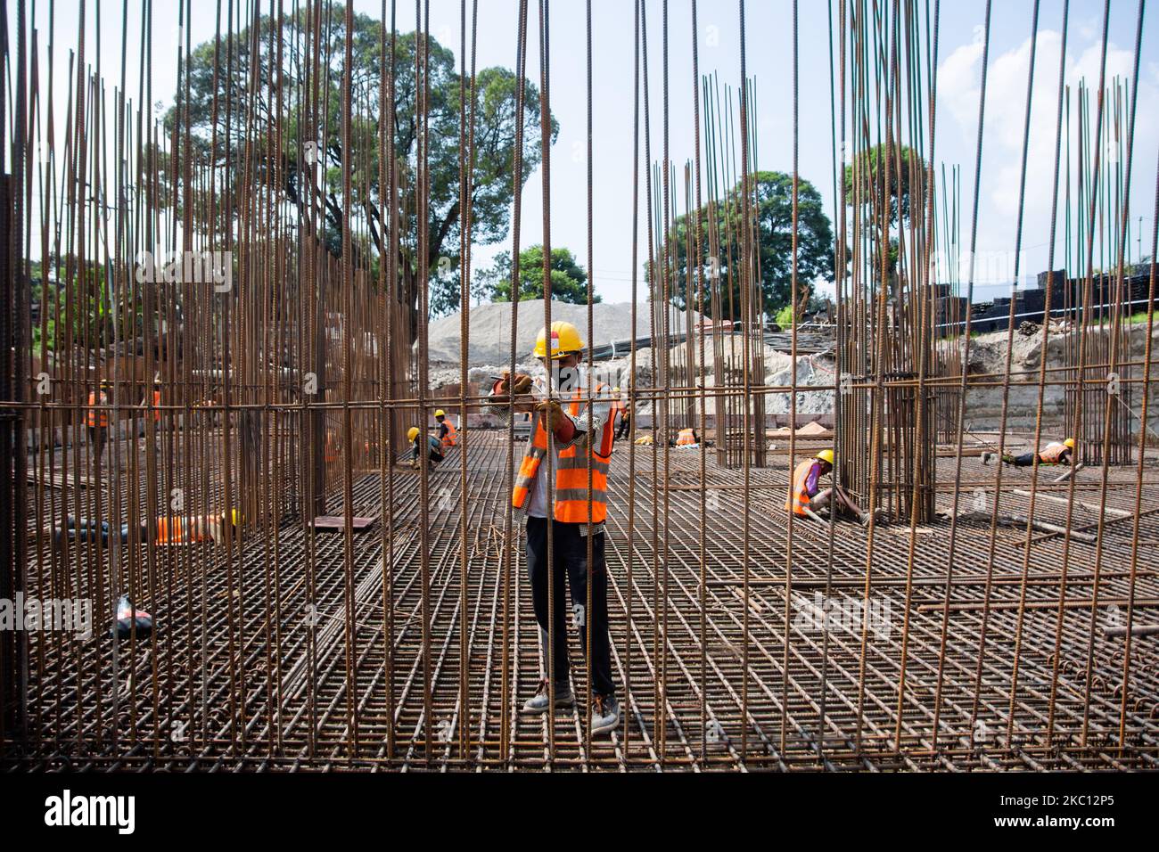 Nepalese workers working at a construction site of new federal ...