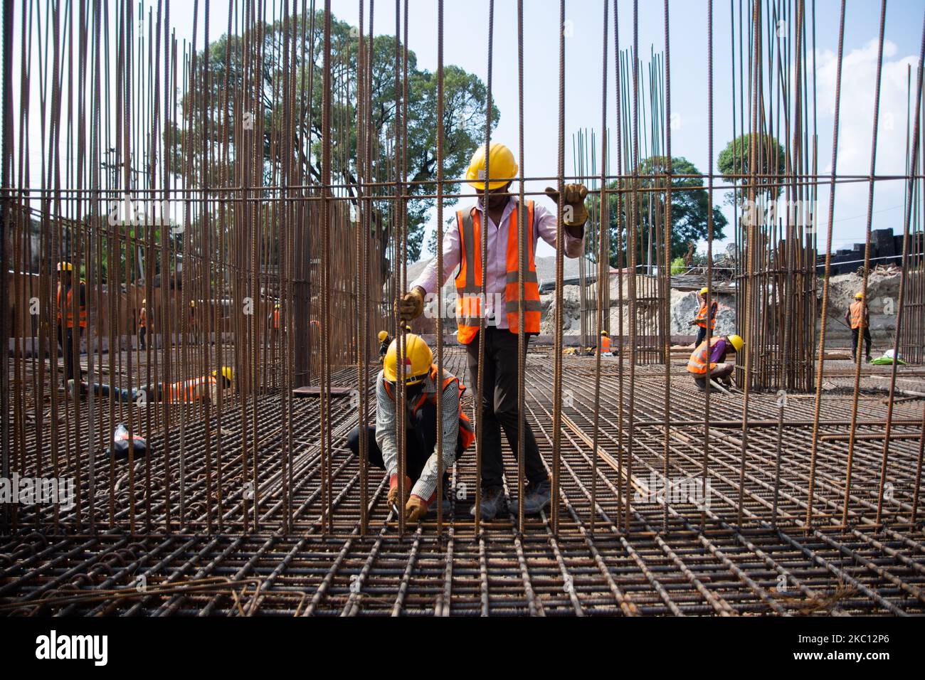 Nepalese workers working at a construction site of new federal ...