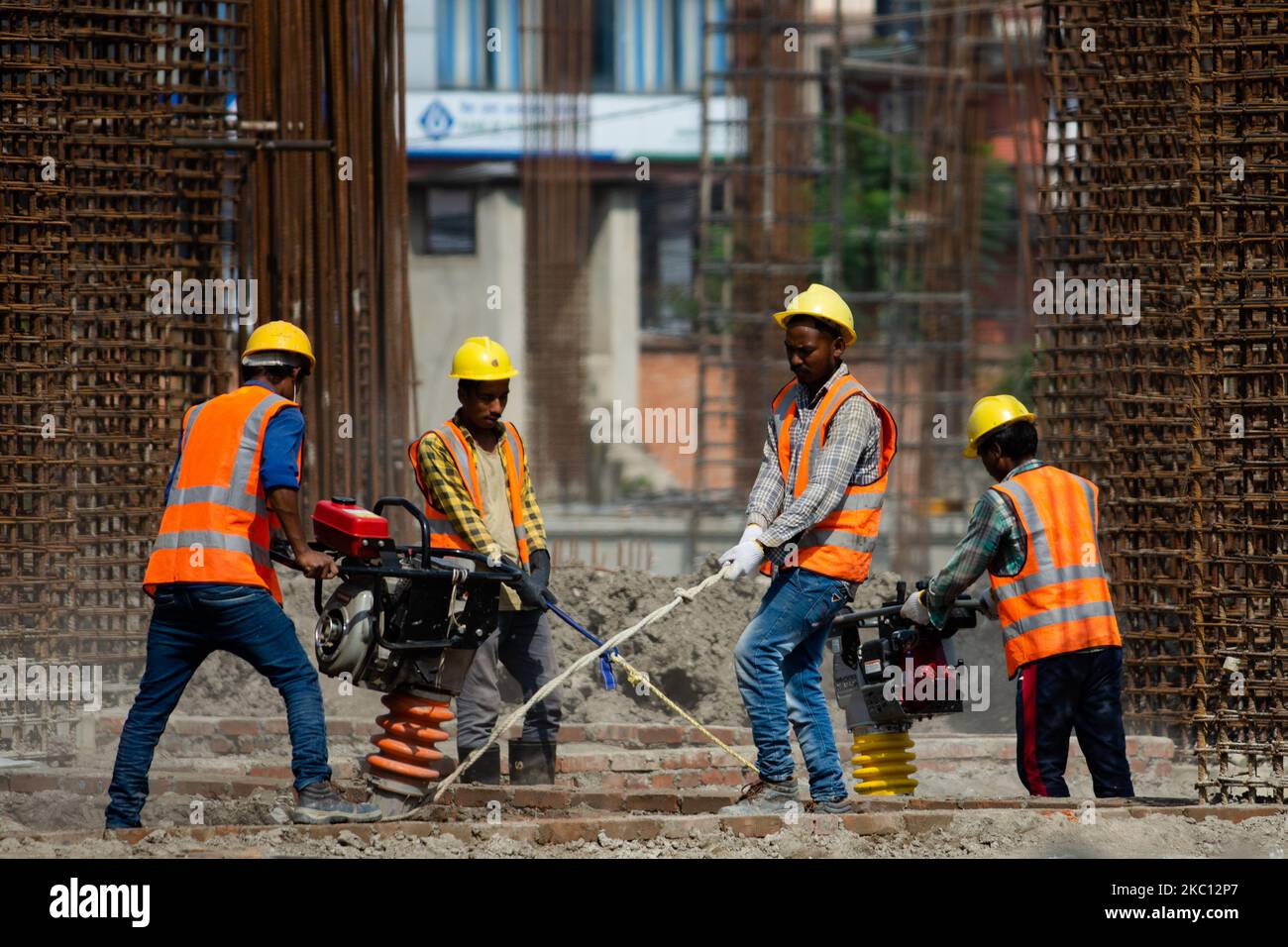 Nepalese workers working at a construction site of new federal ...