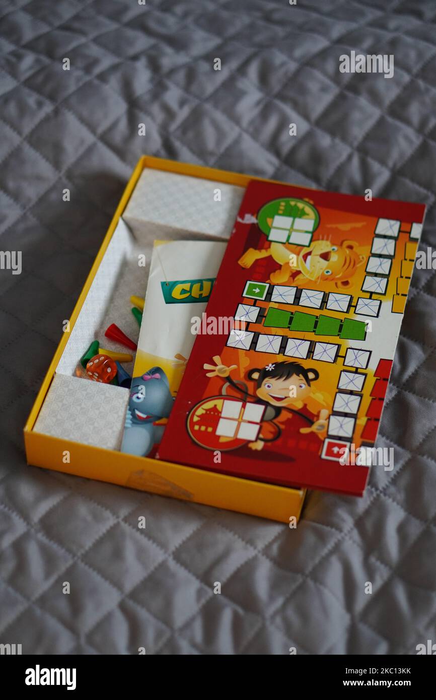 Trefl brand and Polish board game Chinczyk laying on a sheet Stock ...