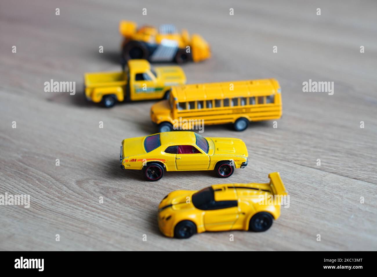A collection of yellow toy vehicles of different brands including Siku ...