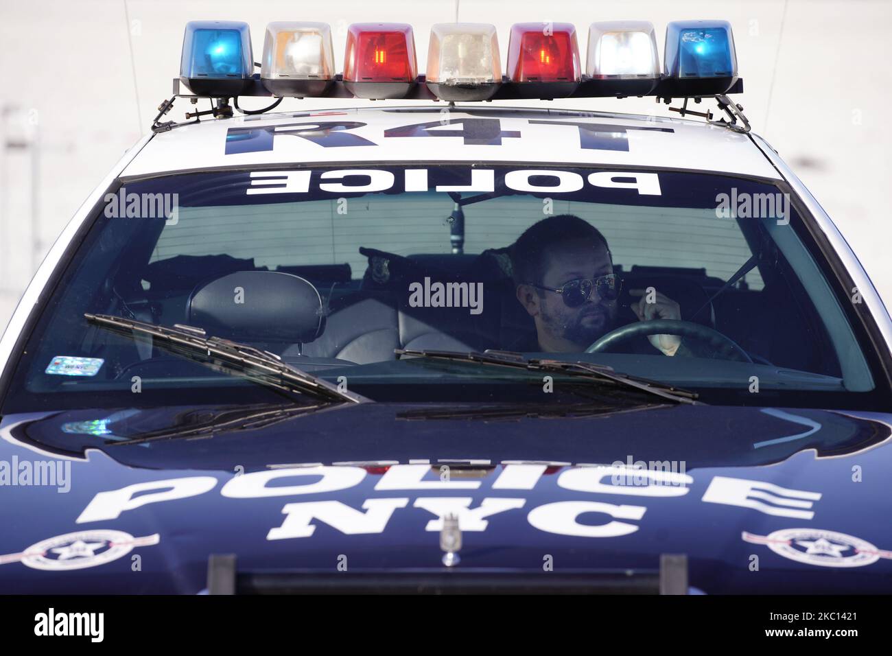 A man in a New York City police car is seen during the American Police ...