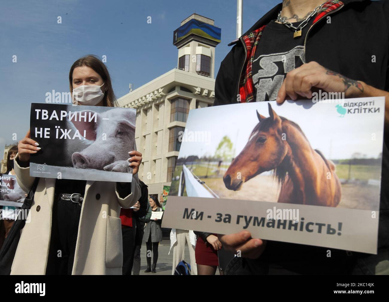 Animal rights supporters hold placards during a rally dedicated to ...