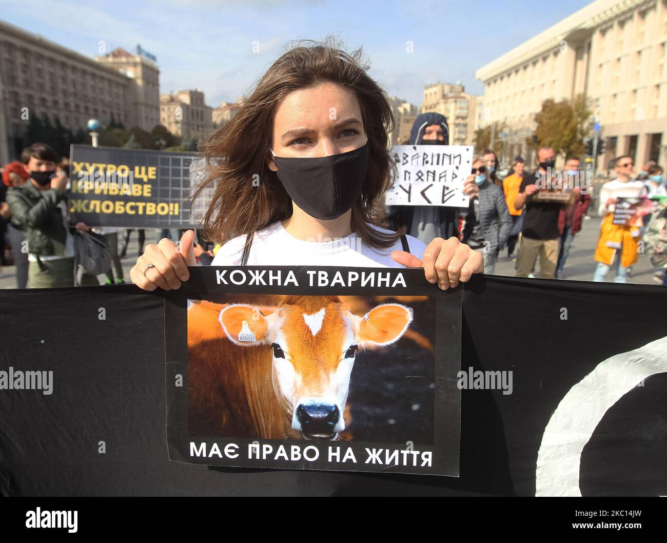 An animal rights supporter holds a placard reading 'Every animal has ...