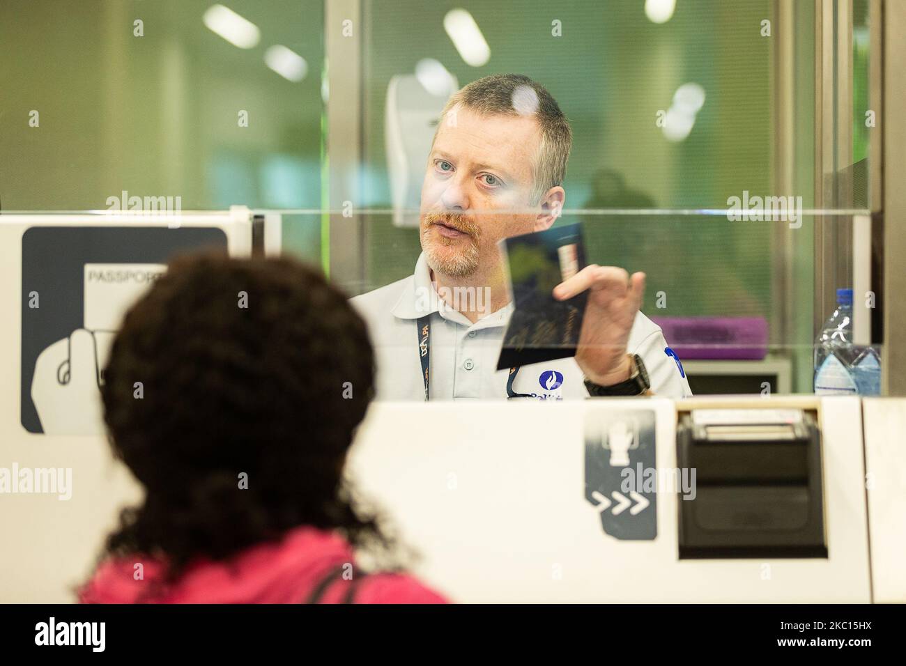 Illustration picture shows a customs officer performing a passport ...