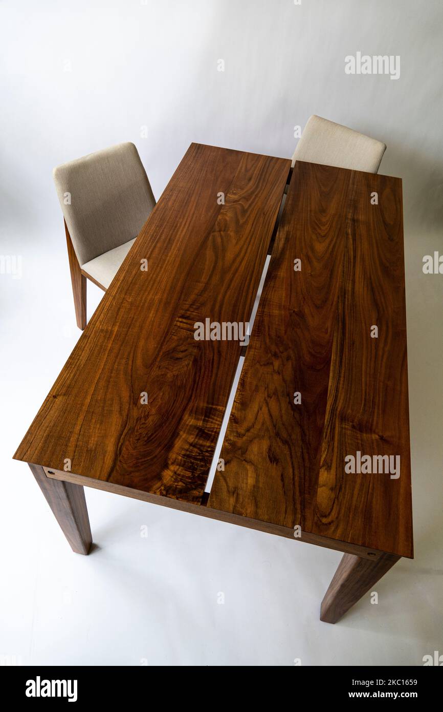 designer wood dining table, minimalist and simple objects on the table ...