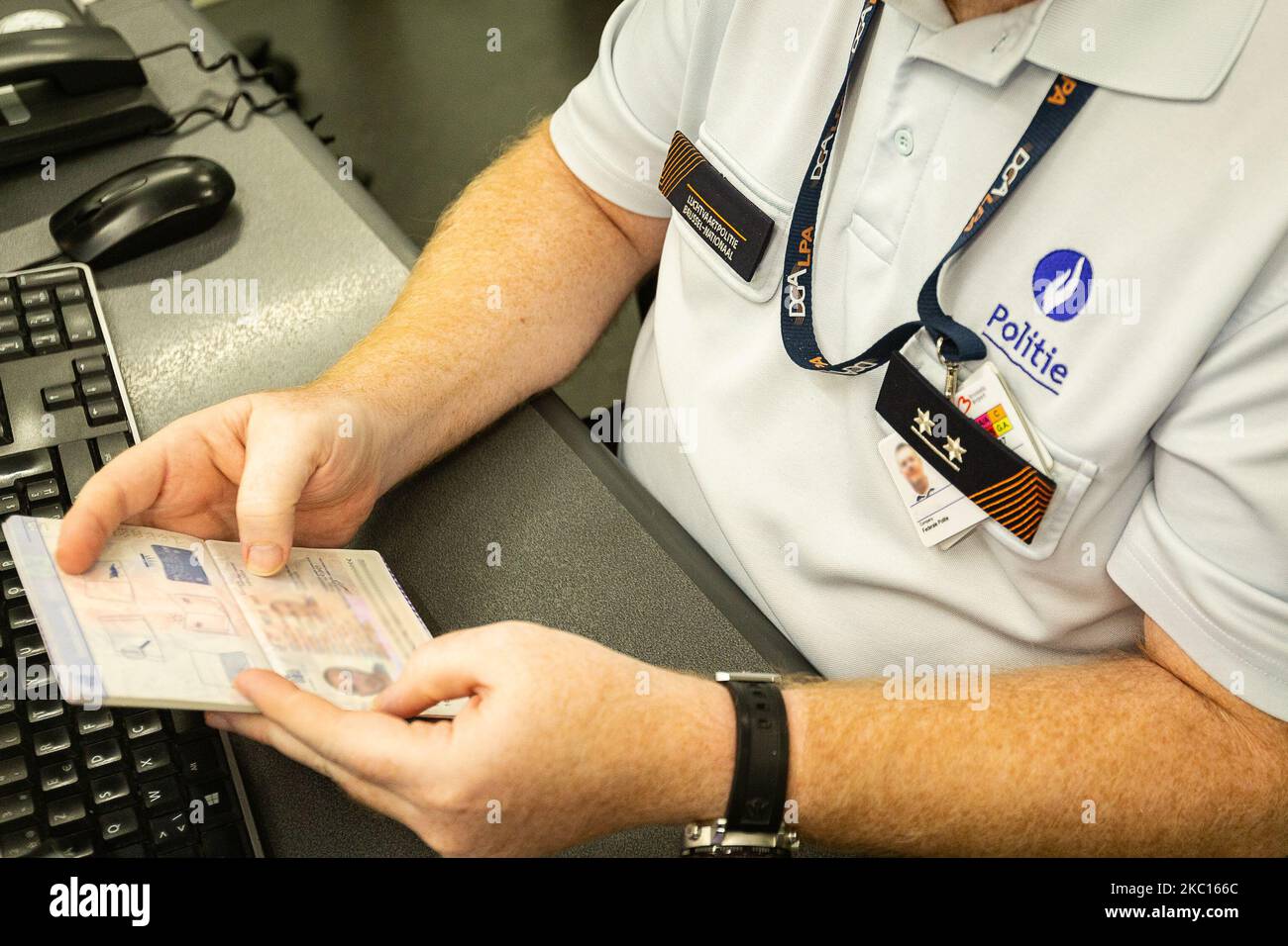 Illustration picture shows a customs officer performing a passport ...