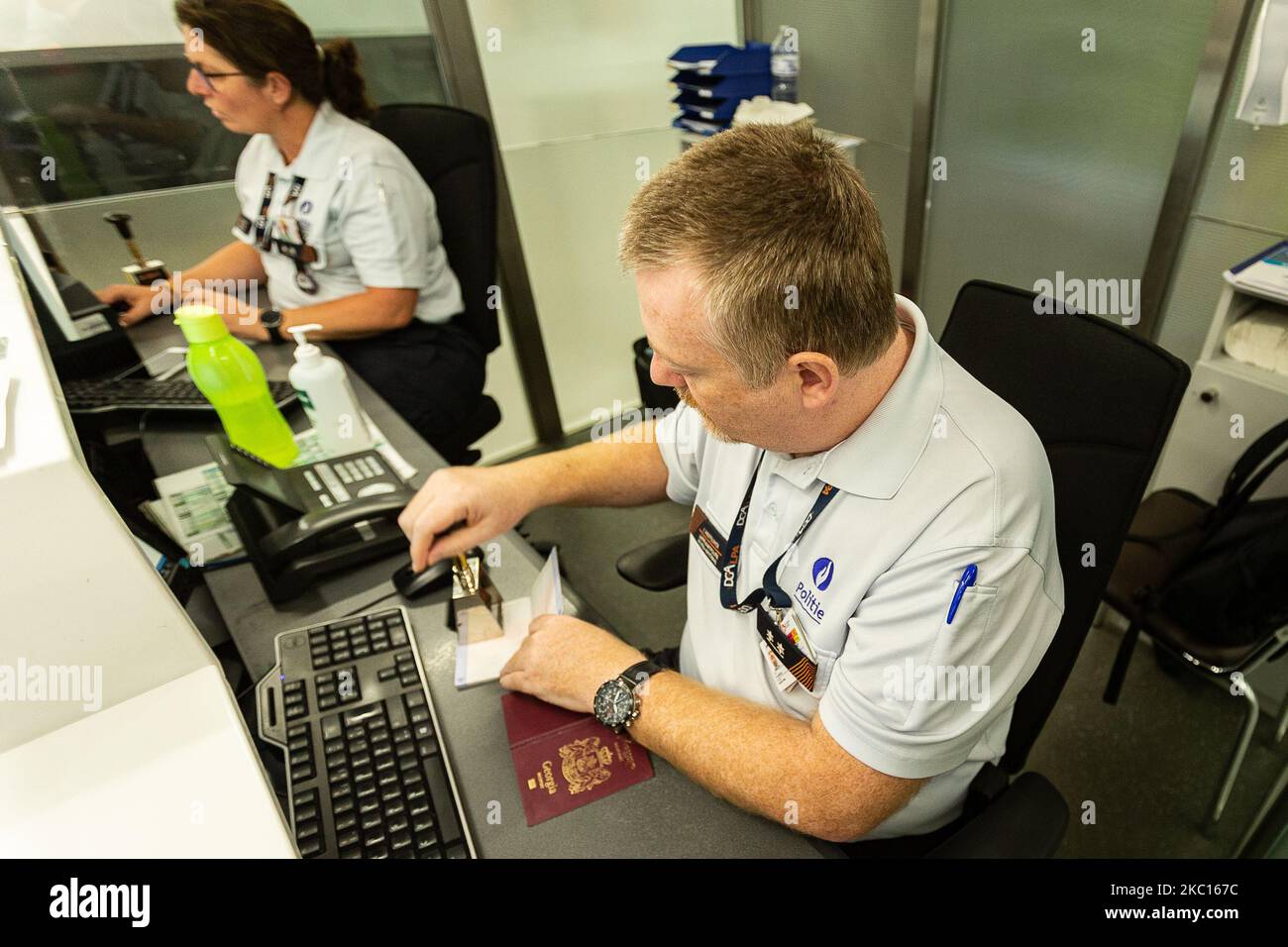 Illustration picture shows a customs officer performing a passport ...