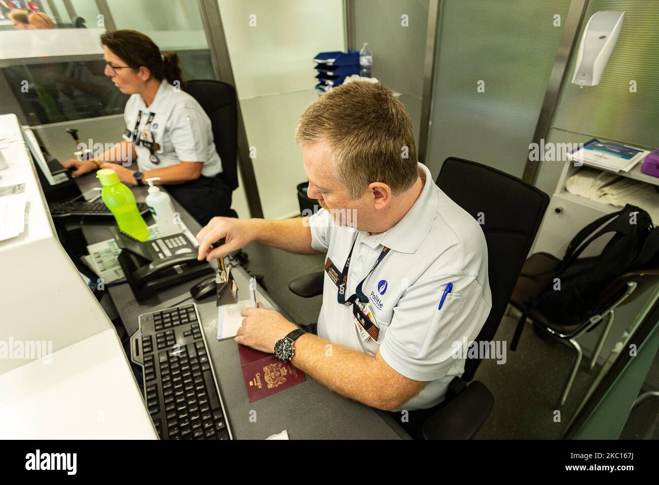 Illustration picture shows a customs officer performing a passport ...