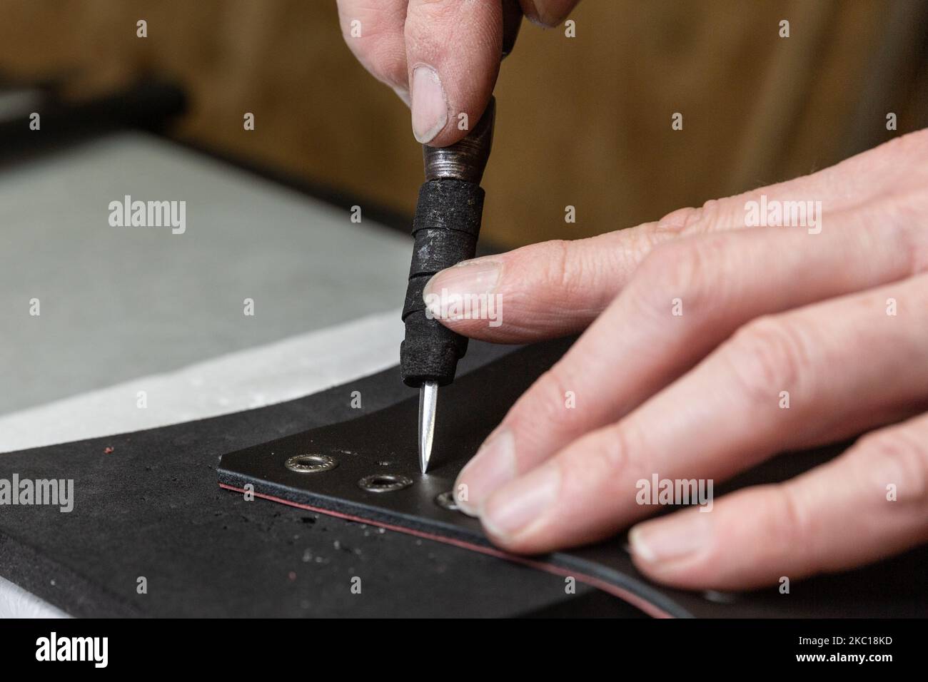 Lukasz Smiejek works in his handmade Cockney boots workshop in London ...