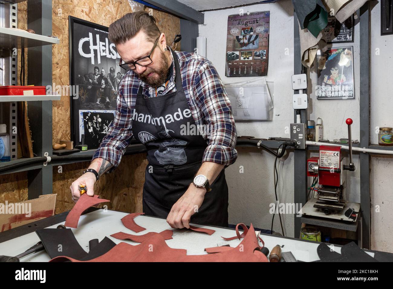 Lukasz Smiejek works in his handmade Cockney boots workshop in London ...