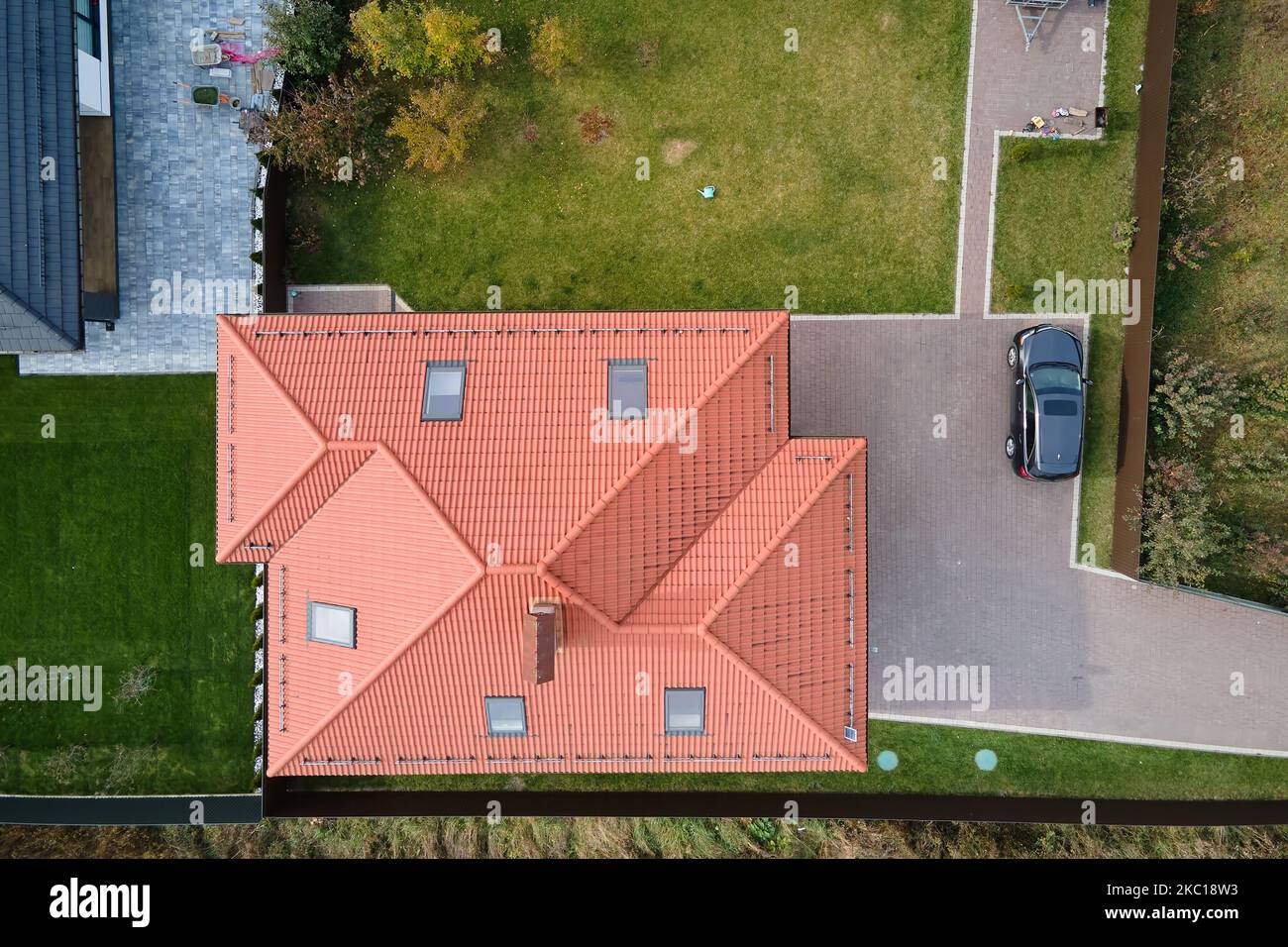 Aerial view of private house with ceramic shingles covered roof top ...