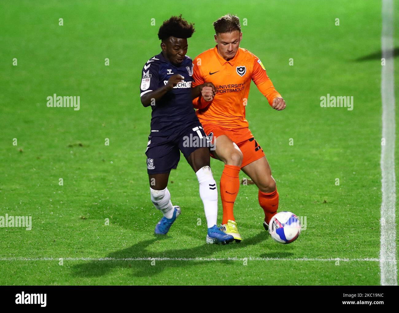 Cameron Pring of Portsmouth battling for possession with Terrell Egbri ...