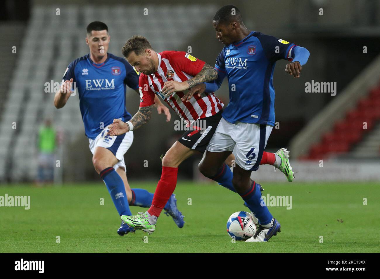Aaron hayden of carlisle united challenges chris maguire of sunderland ...
