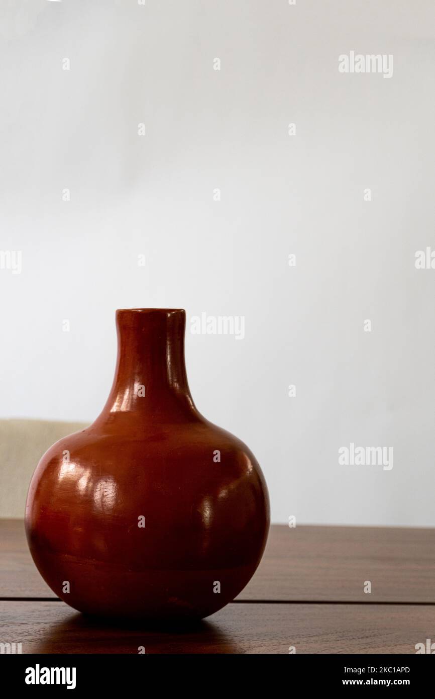 designer wood dining table, minimalist and simple objects on the table ...