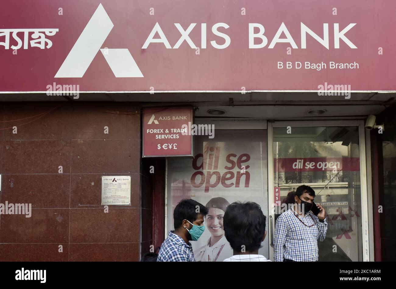 People walk past an Axis Bank in Kolkata, India, 07 October, 2020. Axis ...