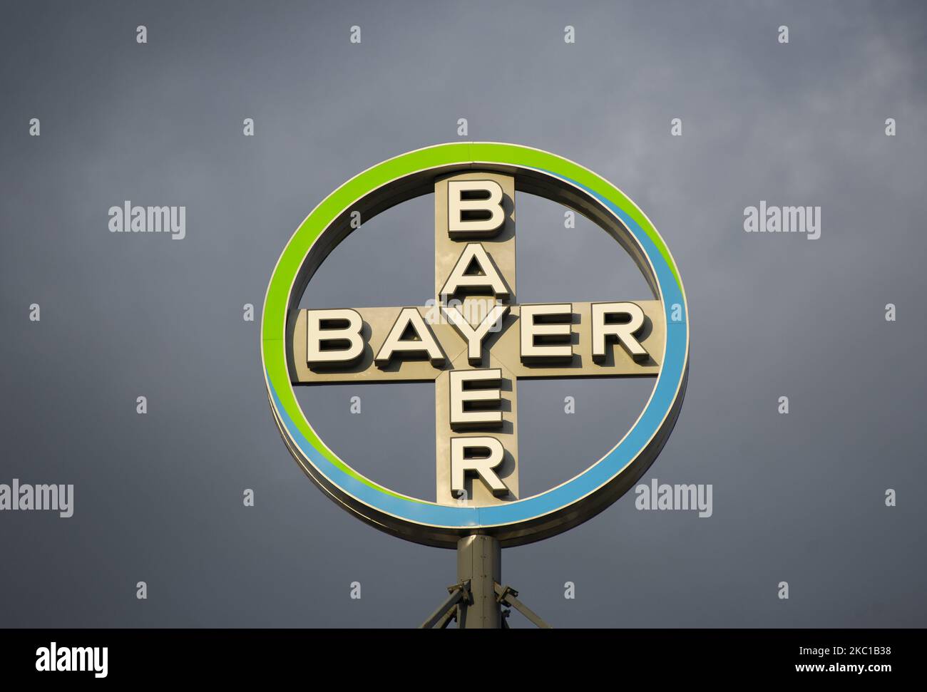 Bayer spinning sign is seen against rain clouds is seen on October 7 ...