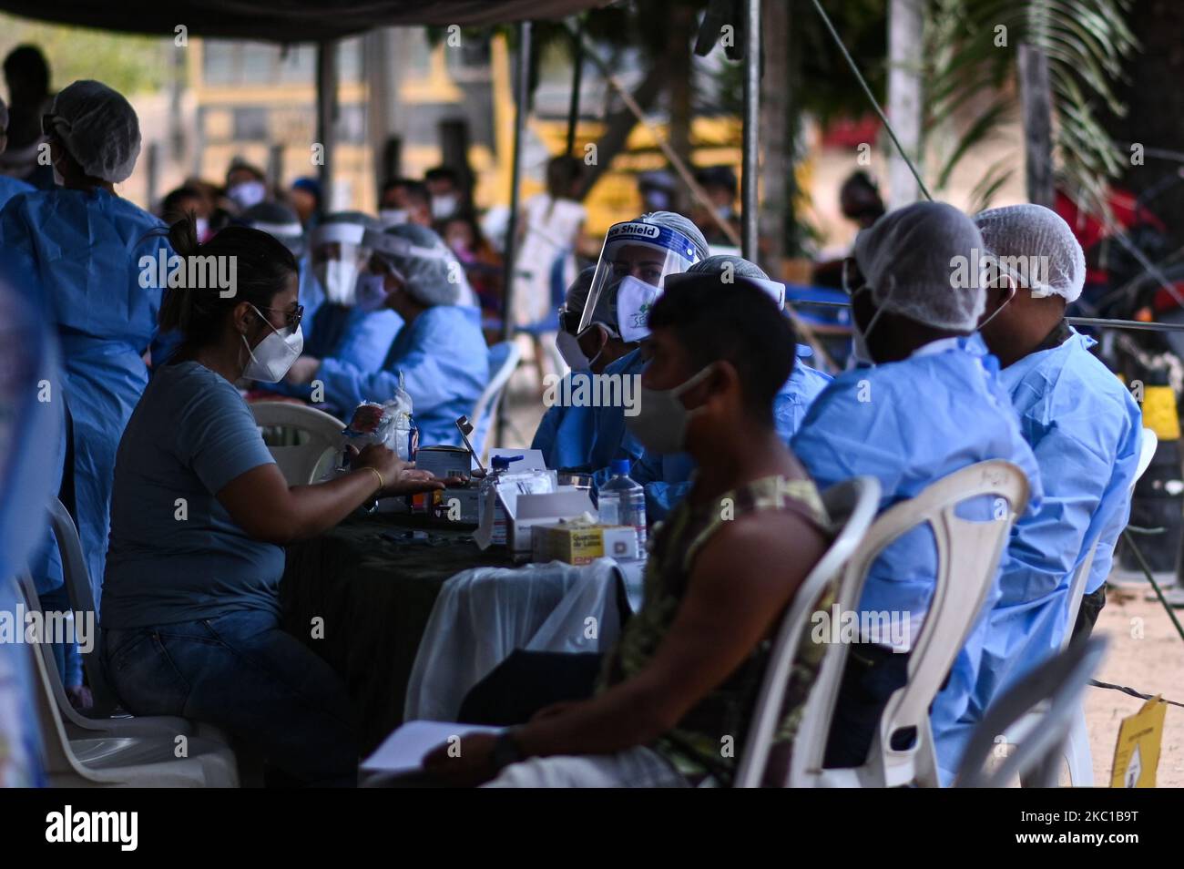 Members of the Brazilian Armed Forces medical team provide medical care ...