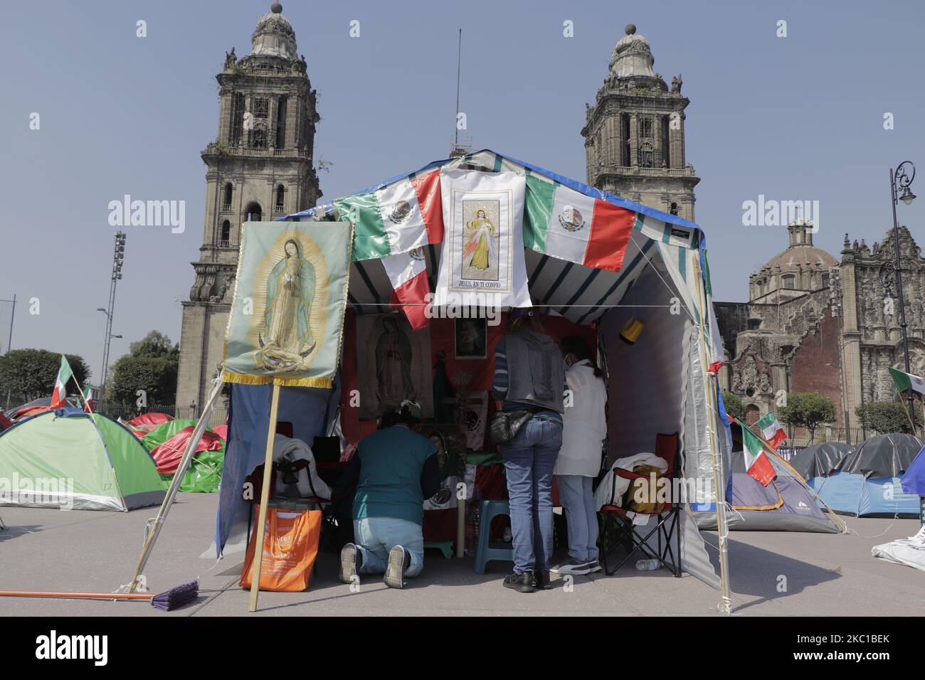 Members of the National Anti-AMLO Front (FRENAAA), set up an altar in a ...