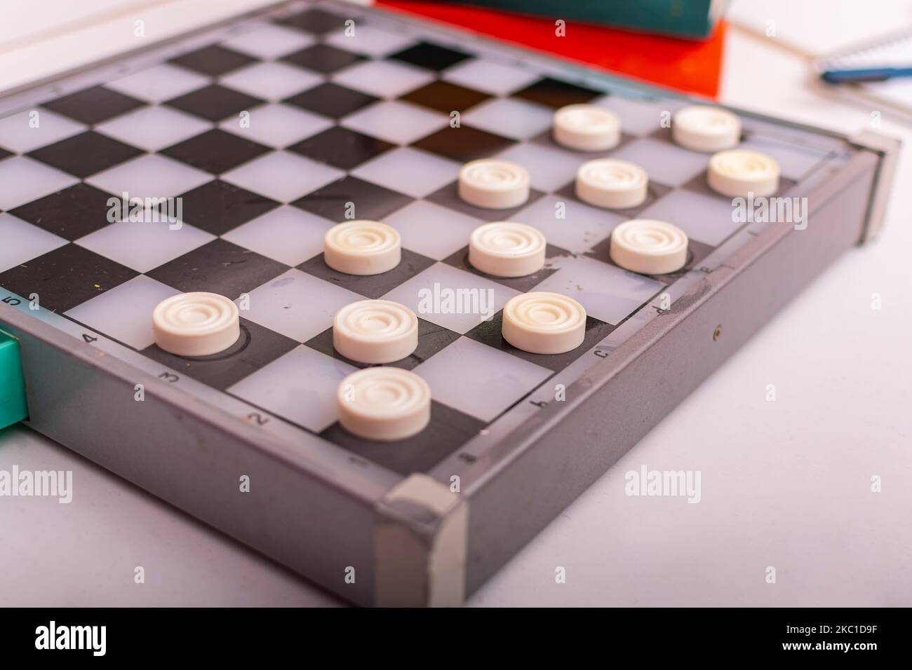 Checkers game. Pieces are placed on game board and everything is ready ...