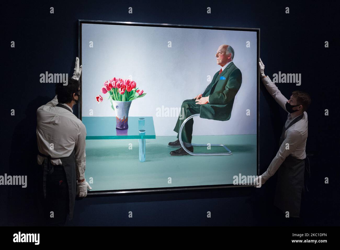 Staff members hold Portrait of Sir David Webster (1971) by David ...