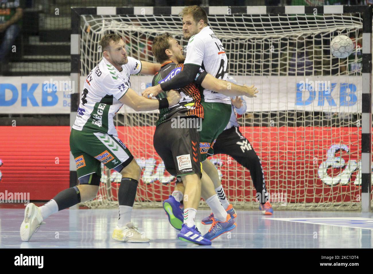 Christian O'Sullivan of SC Magdeburg is attacked by Jacob Bagersted and ...