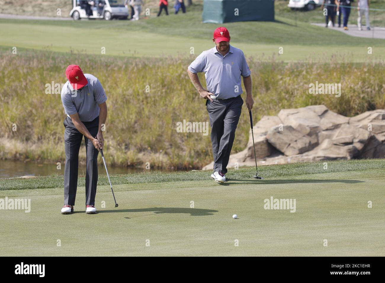 United States Team player Bill Haas and JB Holmes practice playing on ...