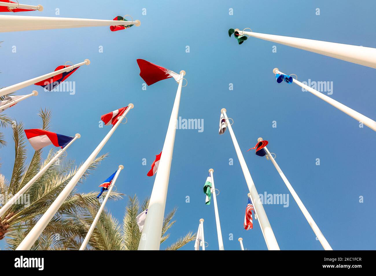 Flags of different countries of world flutters in wind background of ...