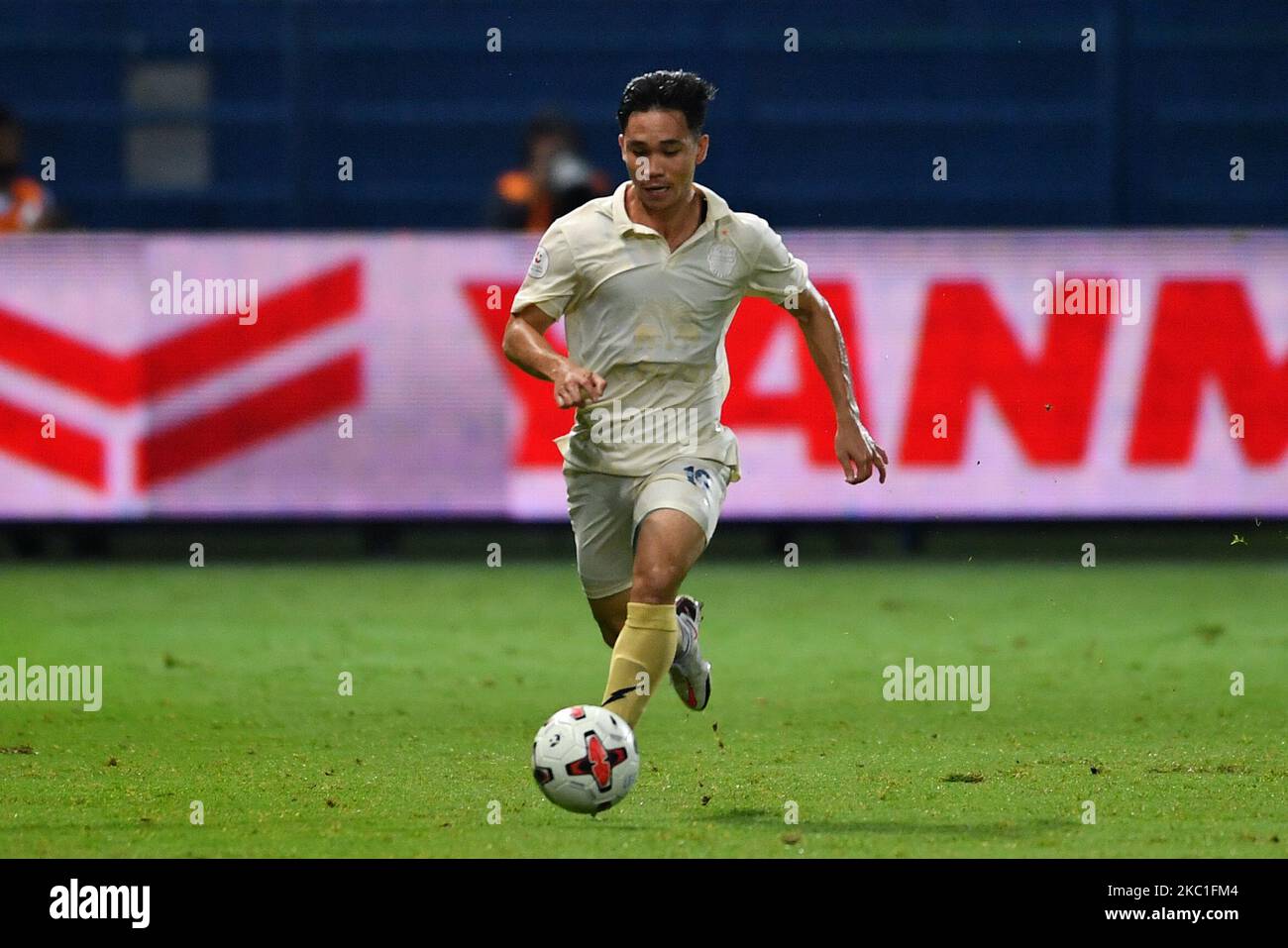 Supachok Sarachat, (white) team player of Buriram United in action ...