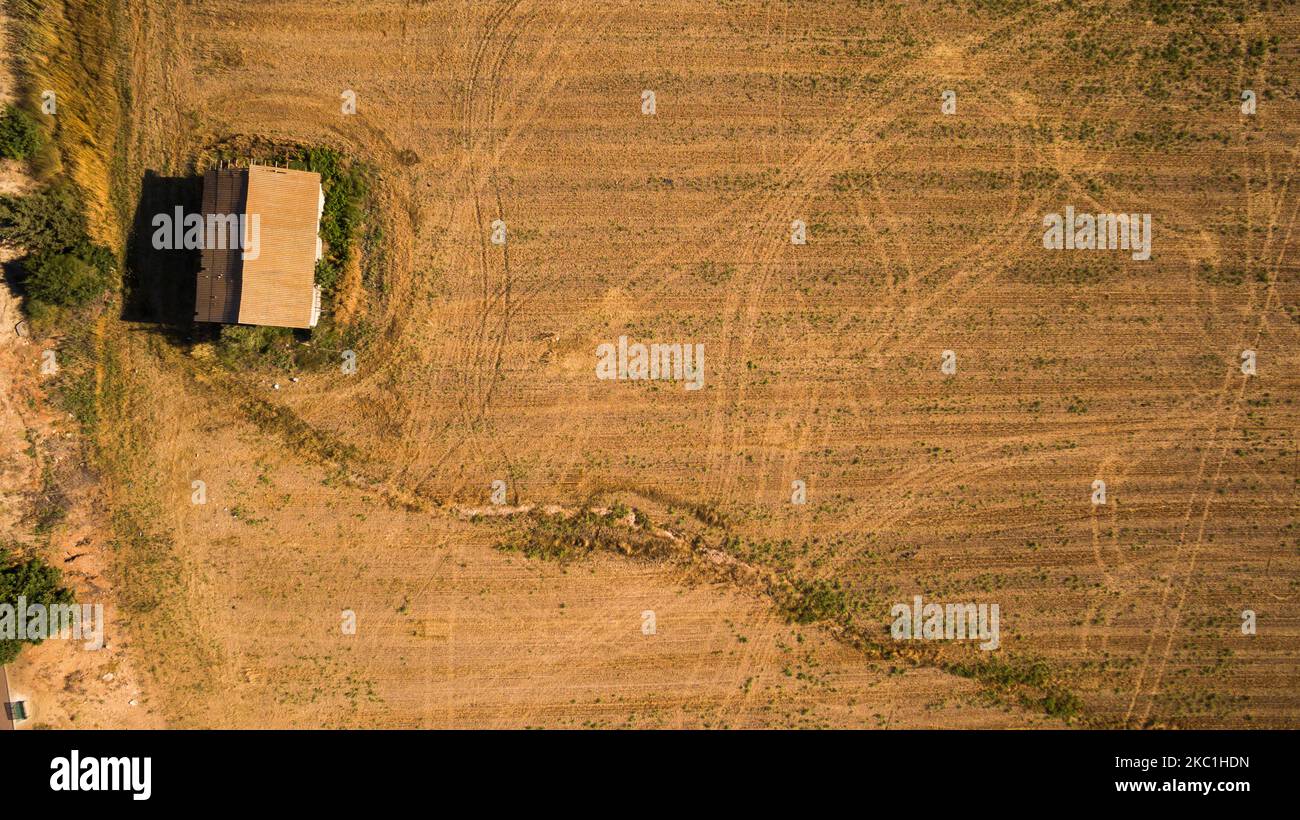 Aerial view of abandoned house standing in the middle of a field Stock ...