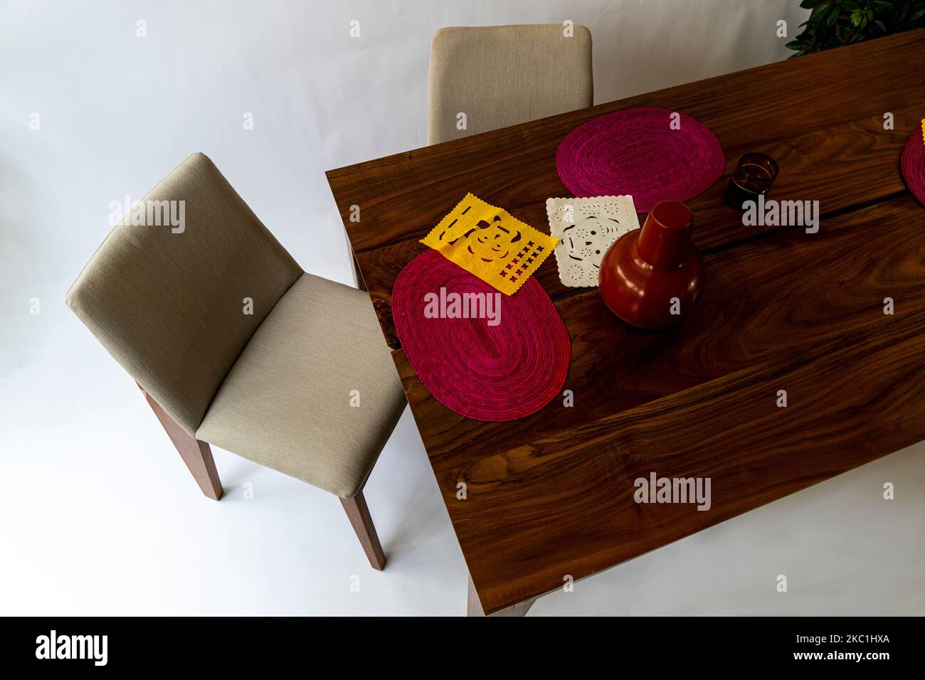 designer wood dining table, minimalist and simple objects on the table ...
