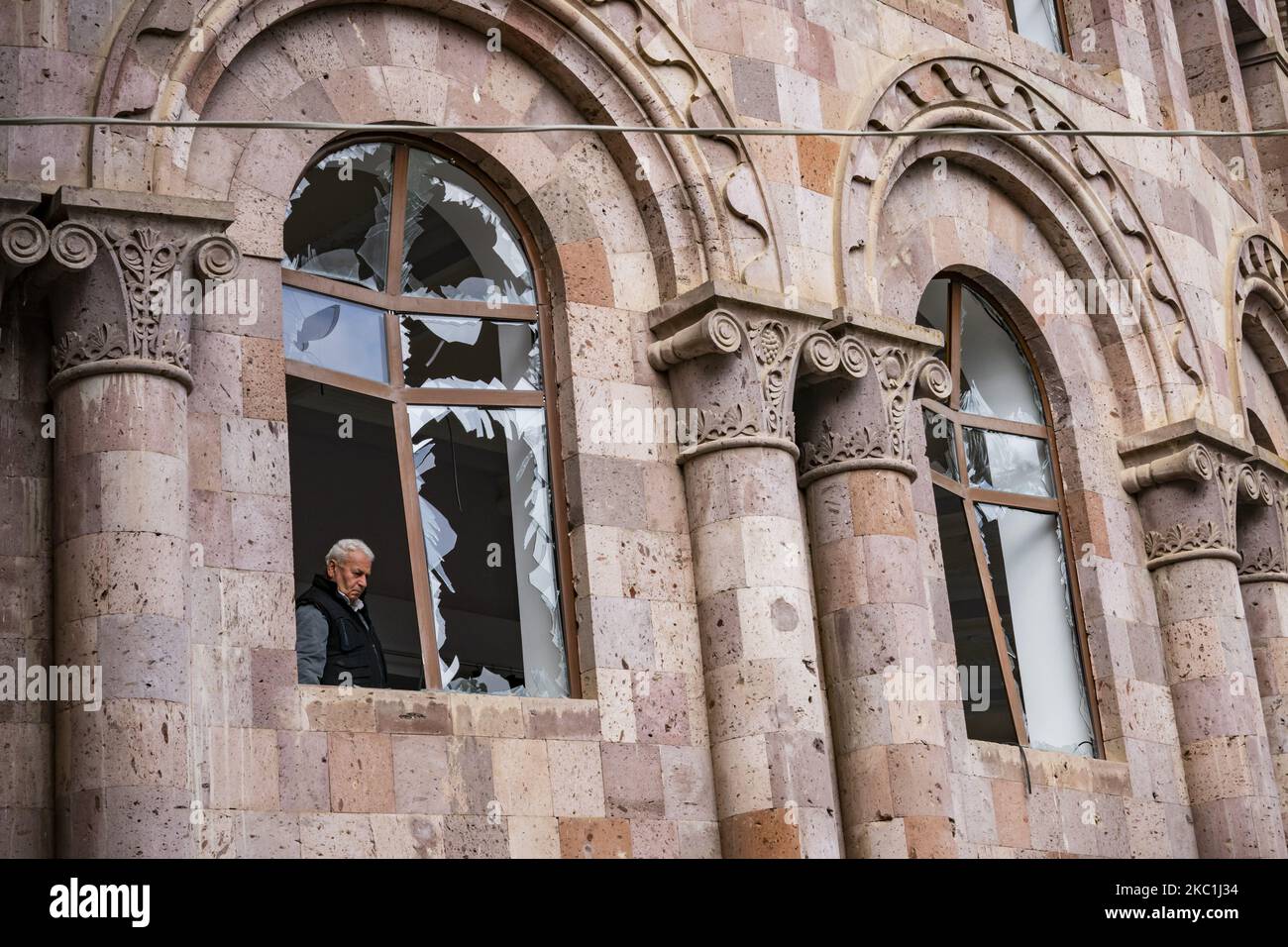 A man stands in a destroyed window of a church after an Azerbaijan ...