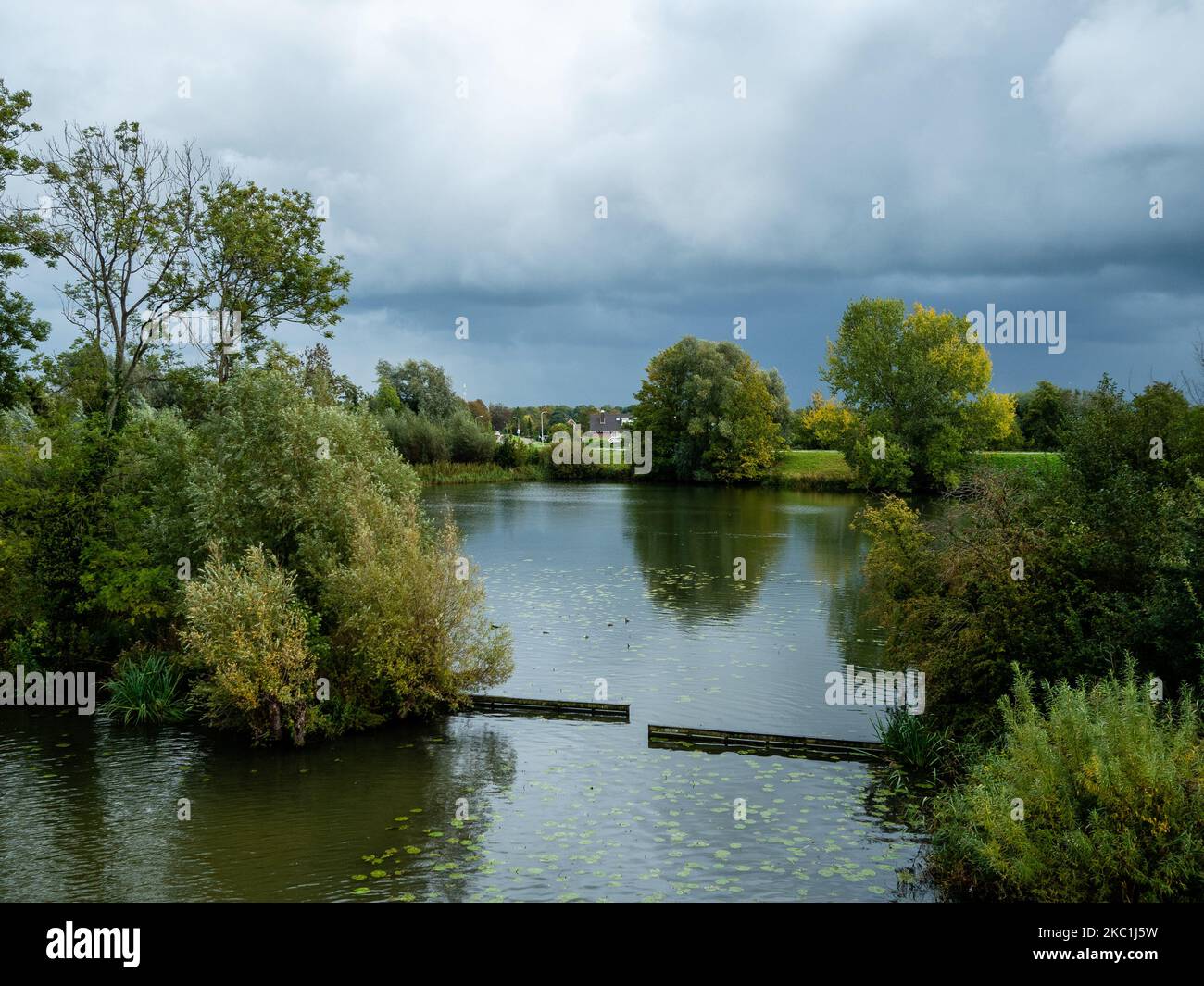 A view of a river in The Netherlands while a storm is coming, on ...