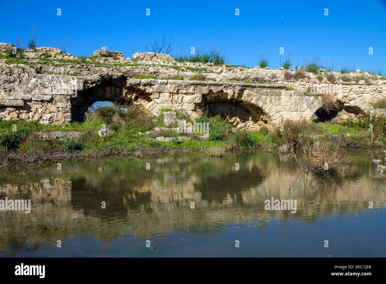 An ancient roman brick stone aqueduct structure in Ceasarea, Israel ...